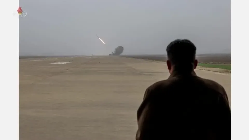 Kim Jong-un watches the test of a new 240mm multiple launch rocket ...