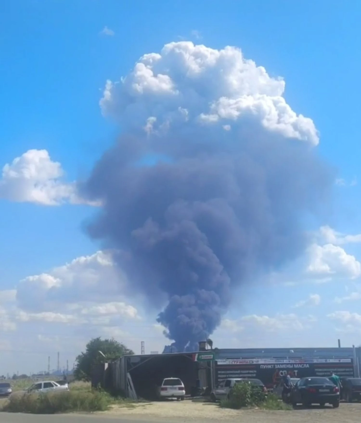 A column of thick black smoke was spotted near an oil refinery in ...